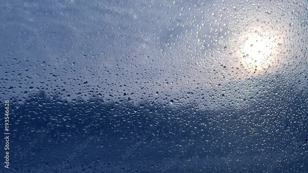 Beautiful water drops on glass car, Close up blue drops water on the ...