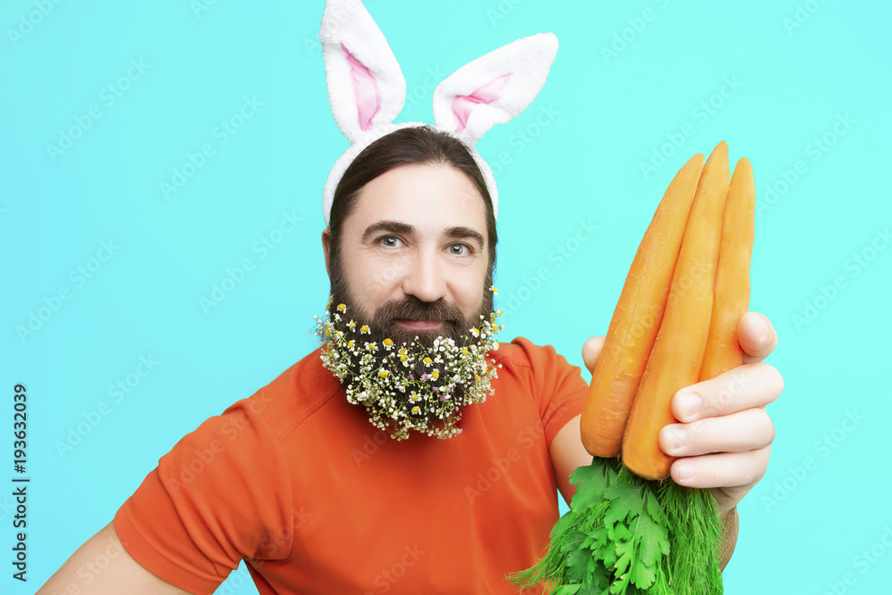 Happy Easter concept. Nice kind muscle man male with spring's flower's ...