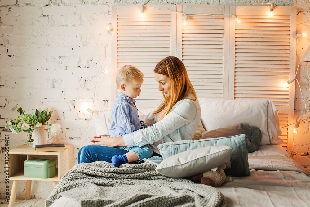 Cute Child Boy and her Mother Embracing. Happy Family at Home Lifestyle ...