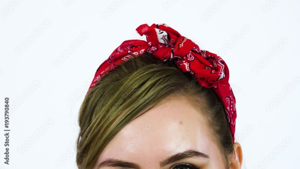 A beautiful 50s pin-up girl dances and smiles at the camera - face ...