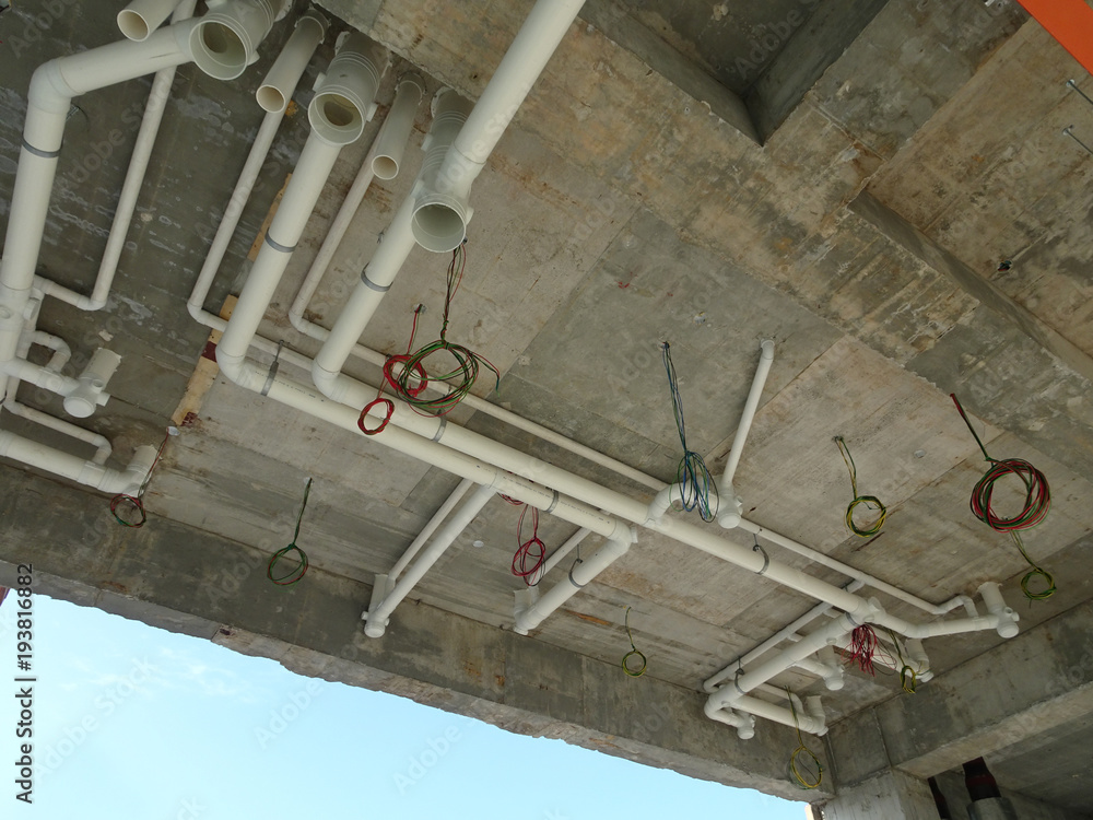 UPVC sewerage pipe below toilet's soffit under construction at the ...