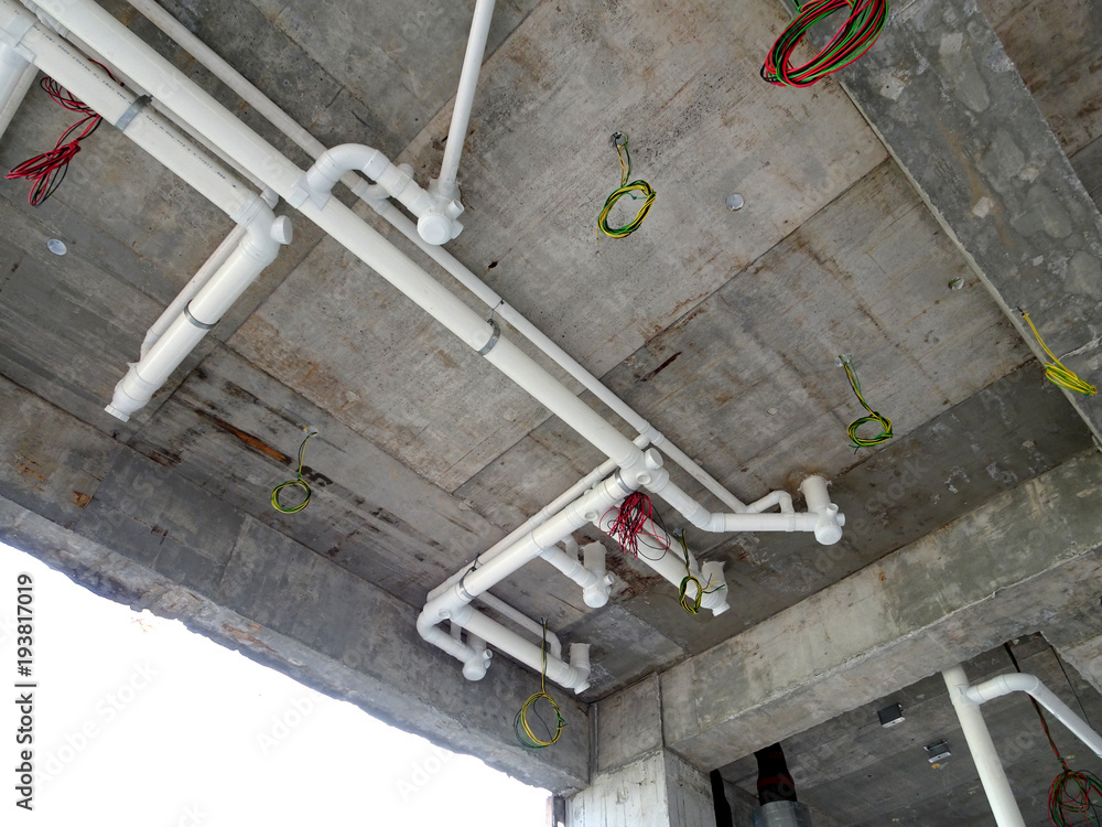 UPVC sewerage pipe below toilet's soffit under construction at the ...