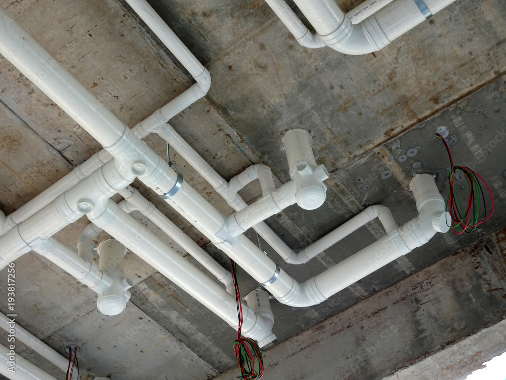 UPVC sewerage pipe below toilet's soffit under construction at the ...