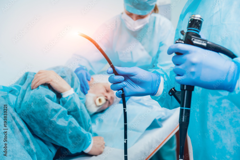 Endoscopy at the hospital. Doctor holding endoscope before gastroscopy ...