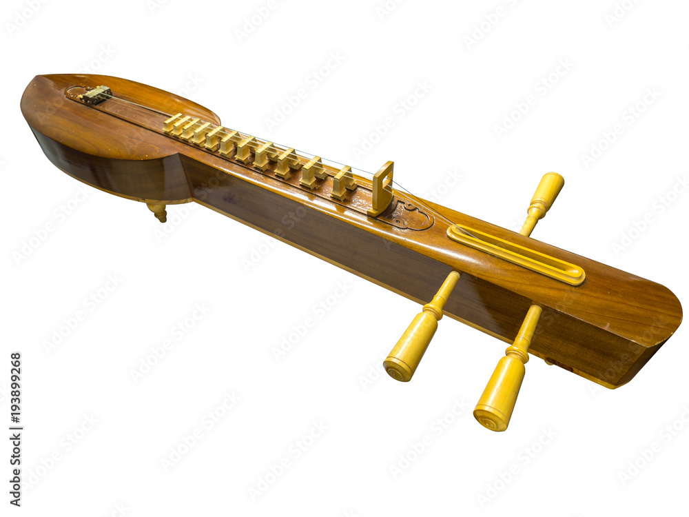 Thai traditional music instrument called zither isolated on white ...