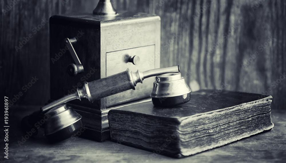 Old telephone and retro book on the desk. The phone of the past Stock ...