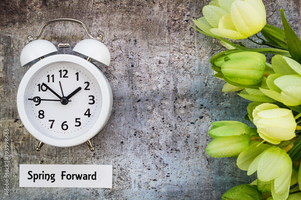 Daylight Savings Time Spring Forward concept top down view with white ...