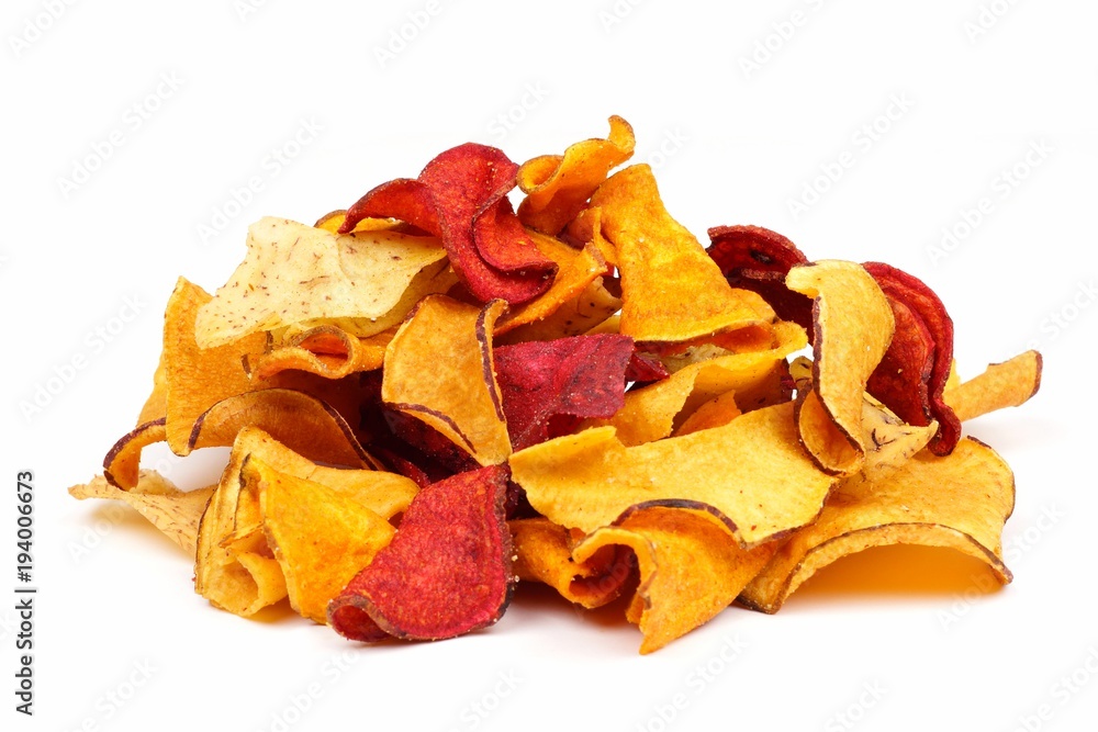 Pile of mixed healthy vegetable chips. Side view, isolated on a white ...