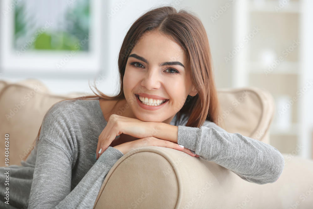 Portrait of young beautiful smiling woman at home Stock Photo | Adobe Stock