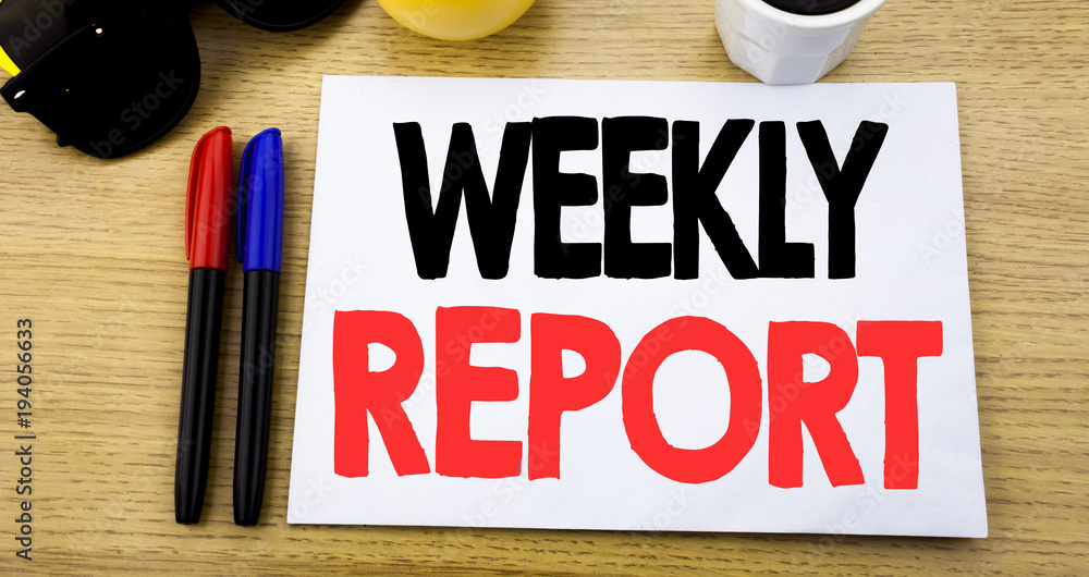 Handwritten text caption showing Weekly Report. Business concept ...