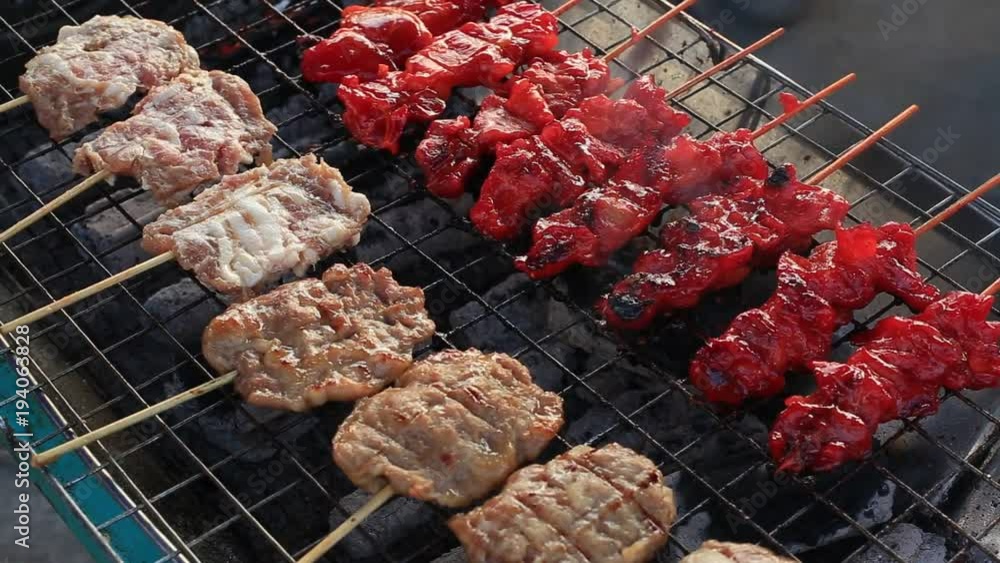 Street food : thai vendor prepares and sells grill pork satay, bbq ...