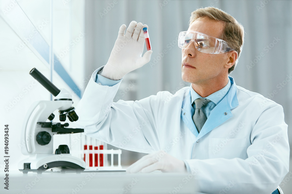 Laboratory Test. Male Doctor Analyzing Blood Sample Stock-Foto | Adobe ...