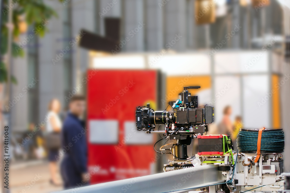 Big professional camera on rails. Outdoors movie set. Cinema production ...