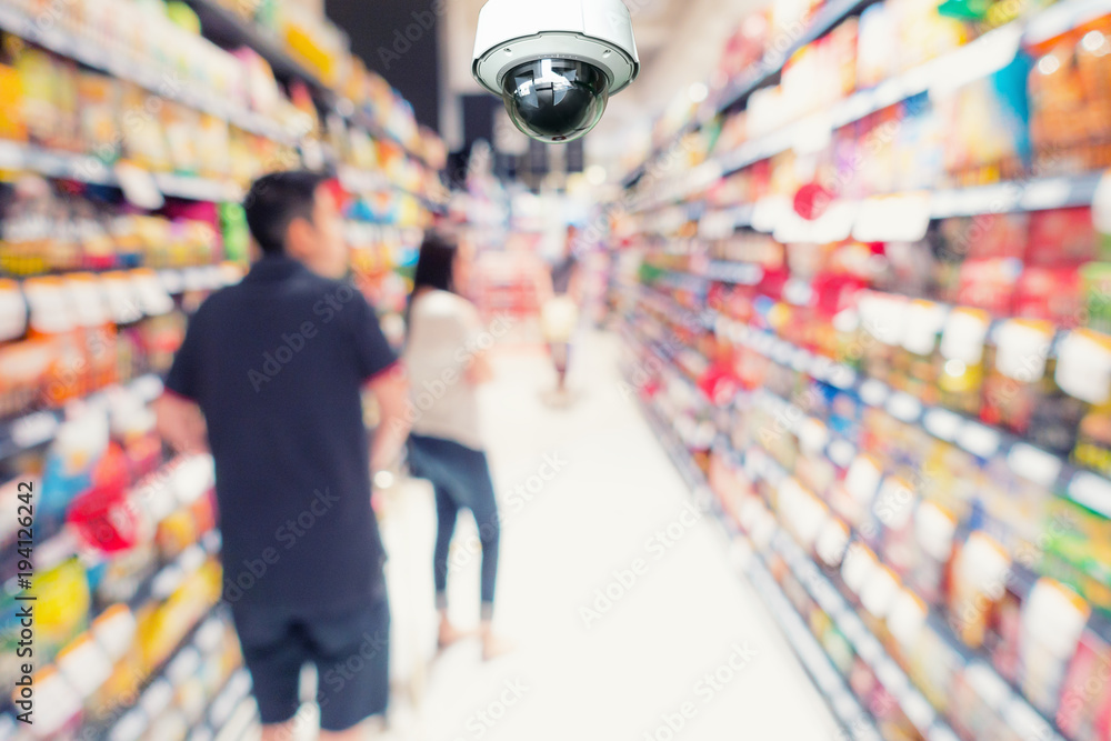 CCTV security camera observation and monitoring in department store ...
