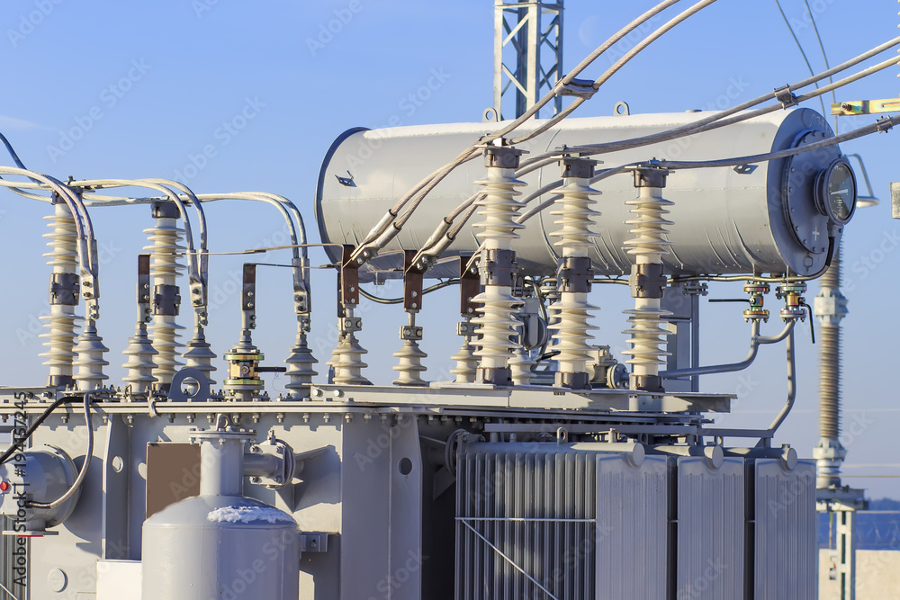 Powerful electrical transformer at high-voltage substation. Industrial ...
