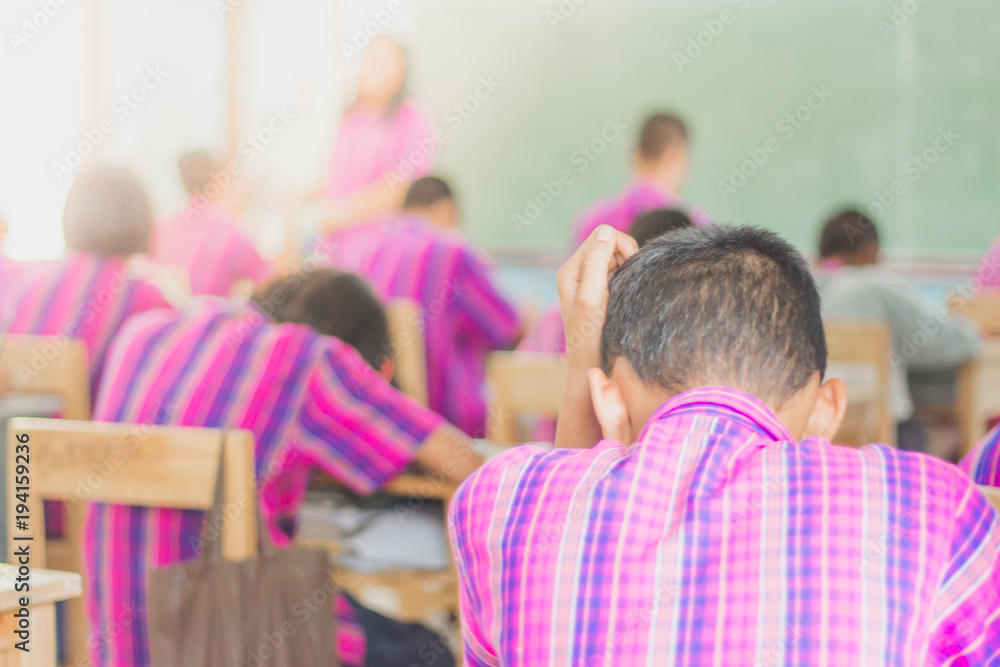 Back view abstract background of examination room with students in ...