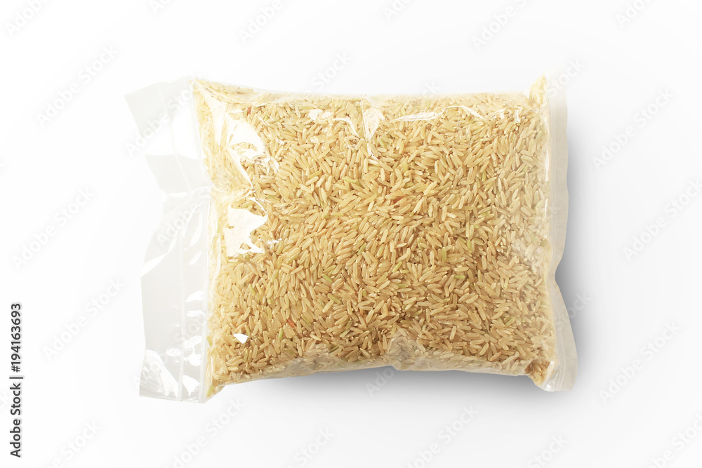 Brown rice in plastic bag isolated on white background / with clipping ...