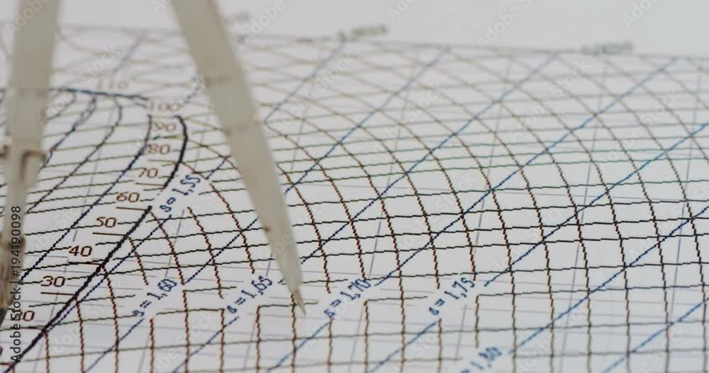 Macro of the compass drawing a circle on the graphic with numbers and ...