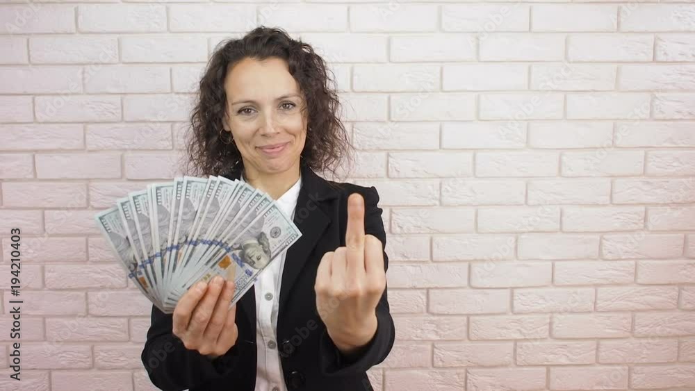 Middle finger. Business woman with money shows middle finger. Stock ビデオ | Adobe Stock