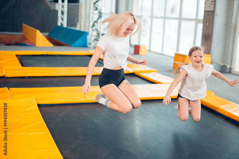 two sisters bouncing in the trampoline park Stock Photo | Adobe Stock