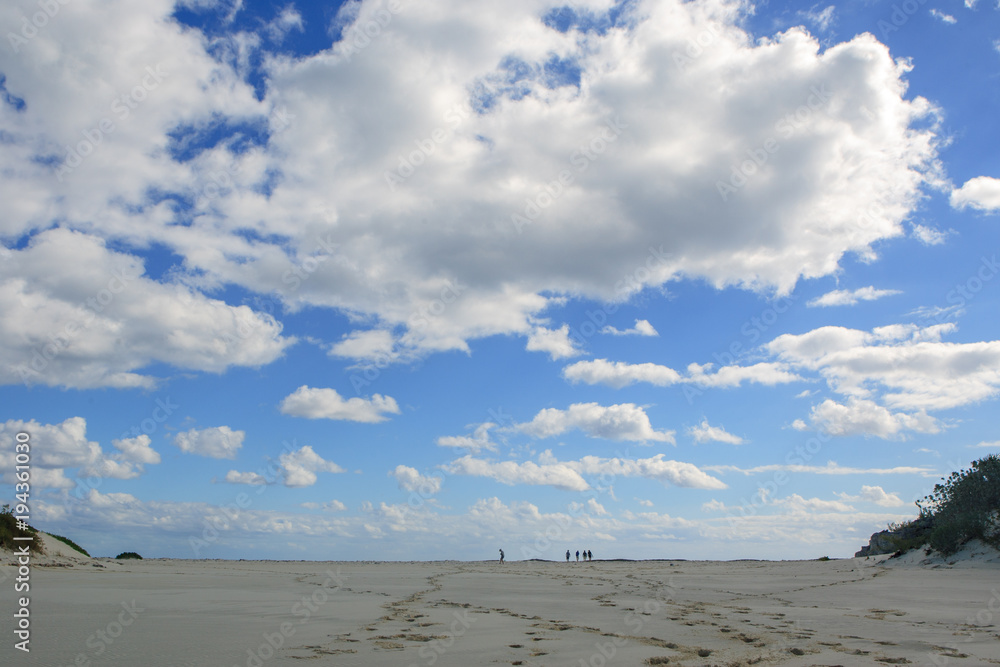 A group of sailors exploring a remote cay in the Exumas Island chain in ...