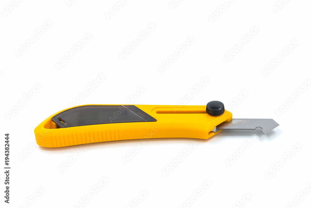 Yellow plastic and laminate cutter knife. 스톡 사진 | Adobe Stock