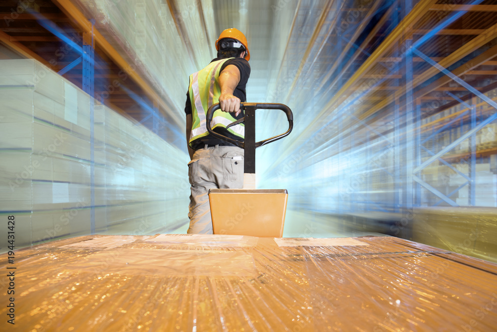 Blur Motion of Warehouse Worker Working with Hand Pallet Truck. Worker ...