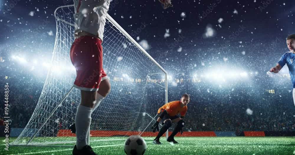 Soccer player scores a goal and runs happily with the ball. Stadium and ...