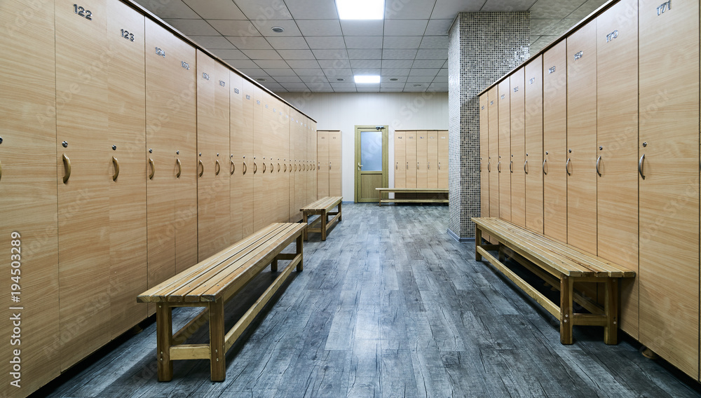 Interior of a locker room. Clean empty dressing room with big lockers ...