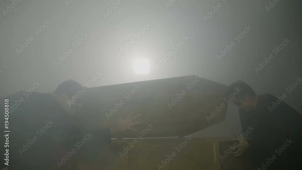 Zombies waking up female creepy vampire opening her coffin on a foggy ...