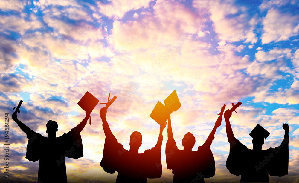Silhouette of Student Graduation. They are seeing sunset. They are ...