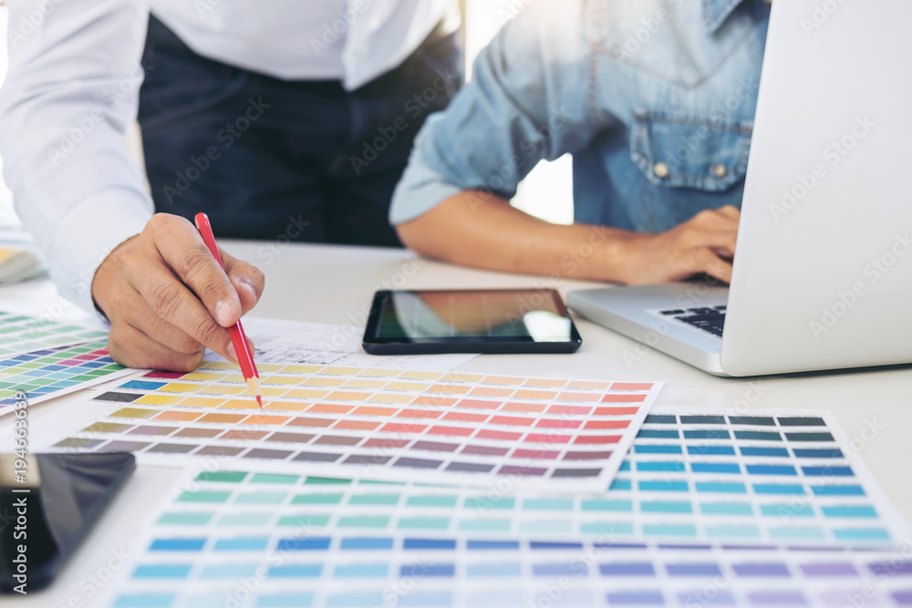 Two interior design or graphic designer at work on project of ...