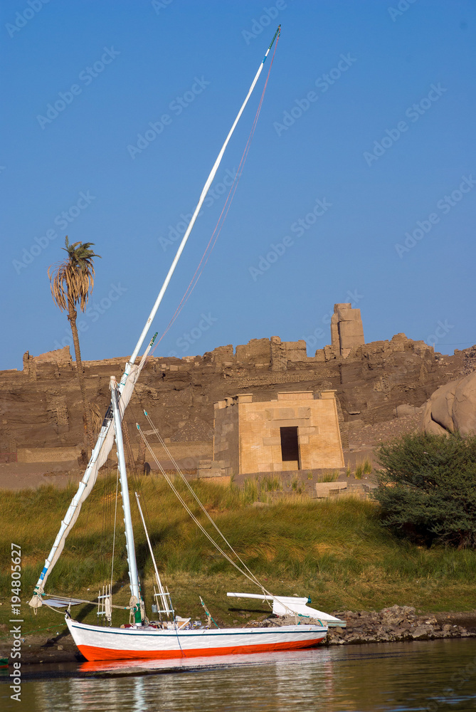 Typical boat of the Nile river called felucca with the sail lowered and ...