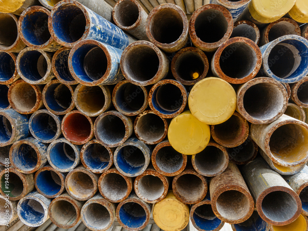 Mental scaffold pipe stack together on scaffold plank wood shelve with ...