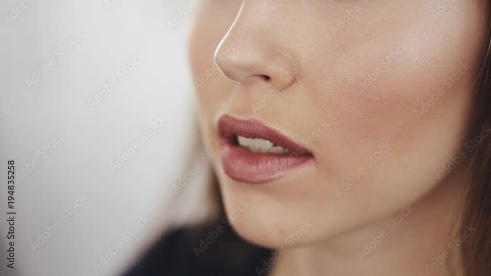 Close up view of beautiful fashion woman lips with lipstick. Mouth open ...