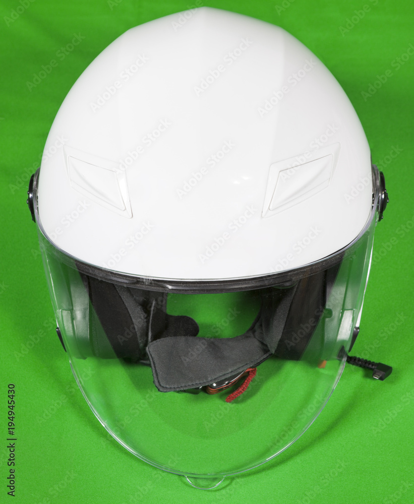 Open face white motorcycle helmet with attached transparent face shield ...