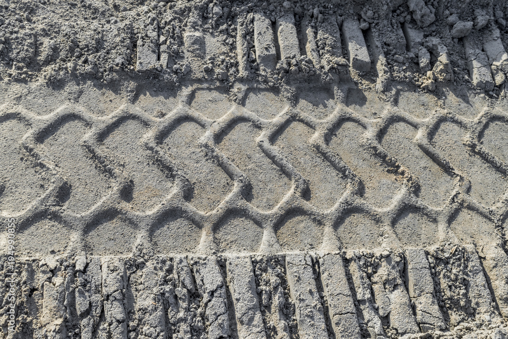 Impressions of wheels on the ground. Traces from the car's tire. Relief ...