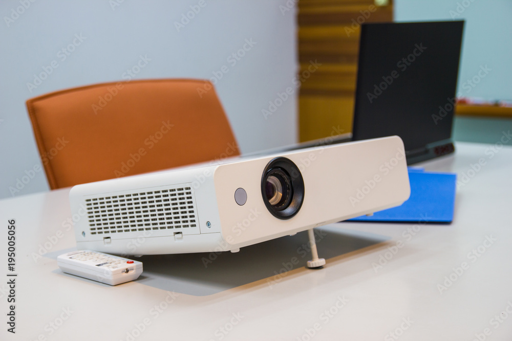 projector connected to Laptop on for presentation in a meeting room ...
