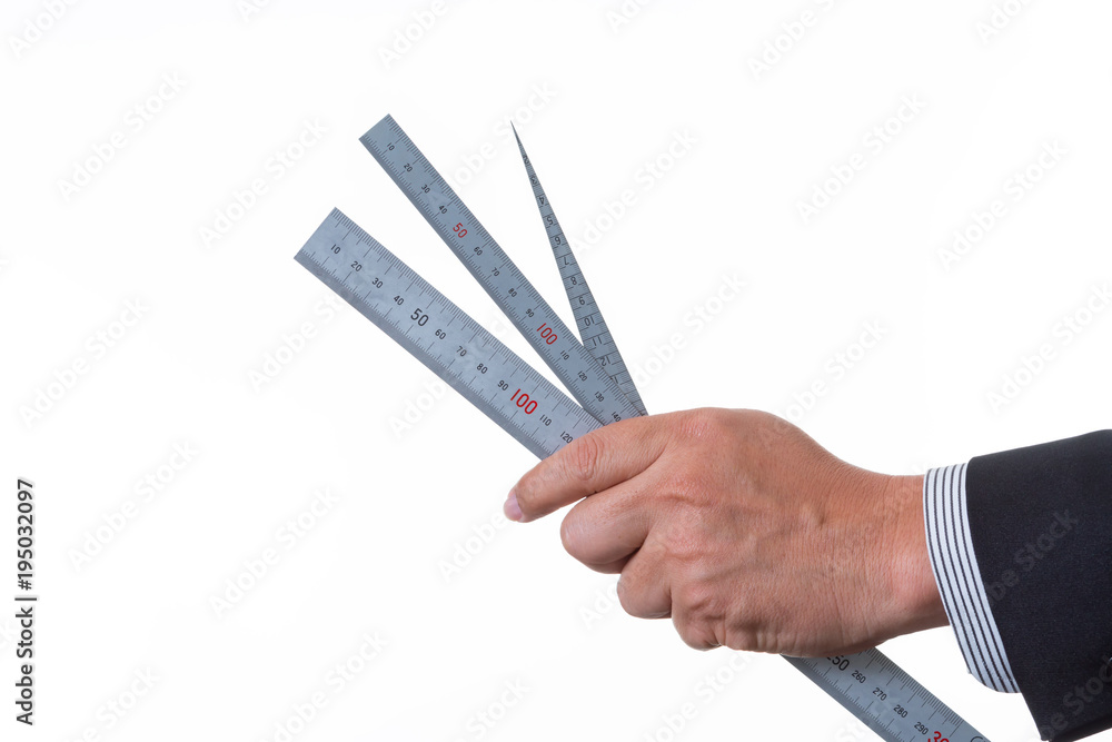 Mechanic engineer holding many scale ruler in his hand; handing scale ...