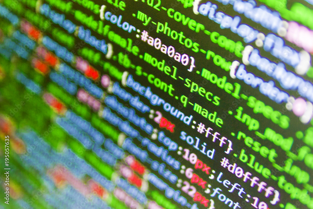 Coworkers team in modern office. Writing programming code on laptop. Developing programming and ...