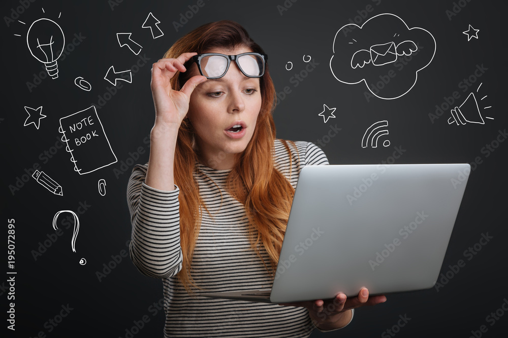 Surprised woman. Curious emotional student putting her glasses up on ...
