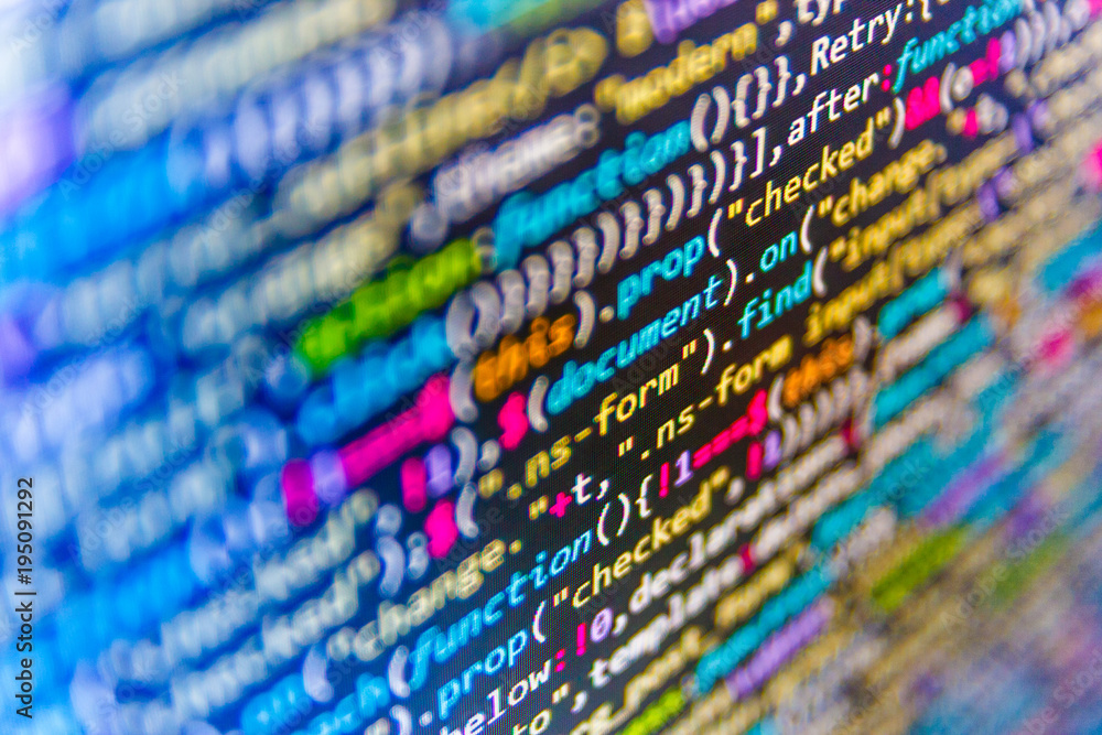 Developer working on websites codes in office. PHP syntax highlighted ...
