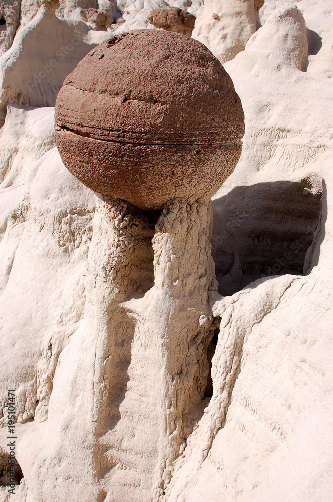 Round, pitted, natural sandstone rocks in the desert badlands of Bisti ...