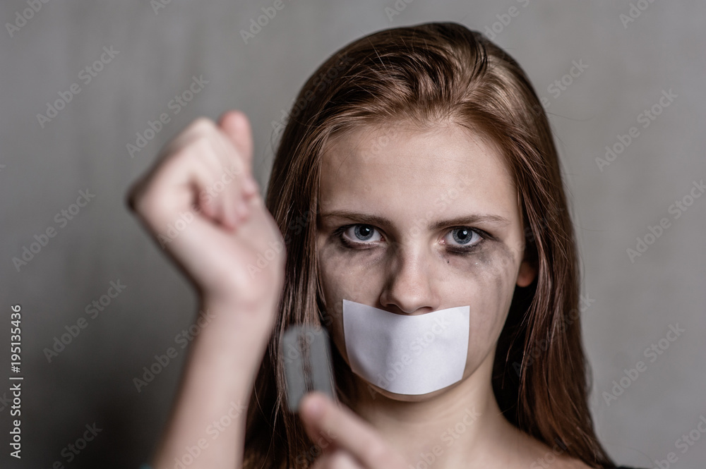 Close up teen girl cuts veins on a hand with a taped mouth Stock Photo ...