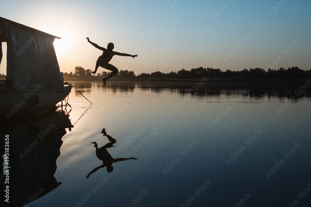 child jumping into the water Stock Photo | Adobe Stock