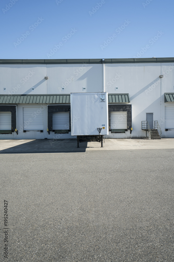 Truck trailer at a loading dock Stock Photo | Adobe Stock