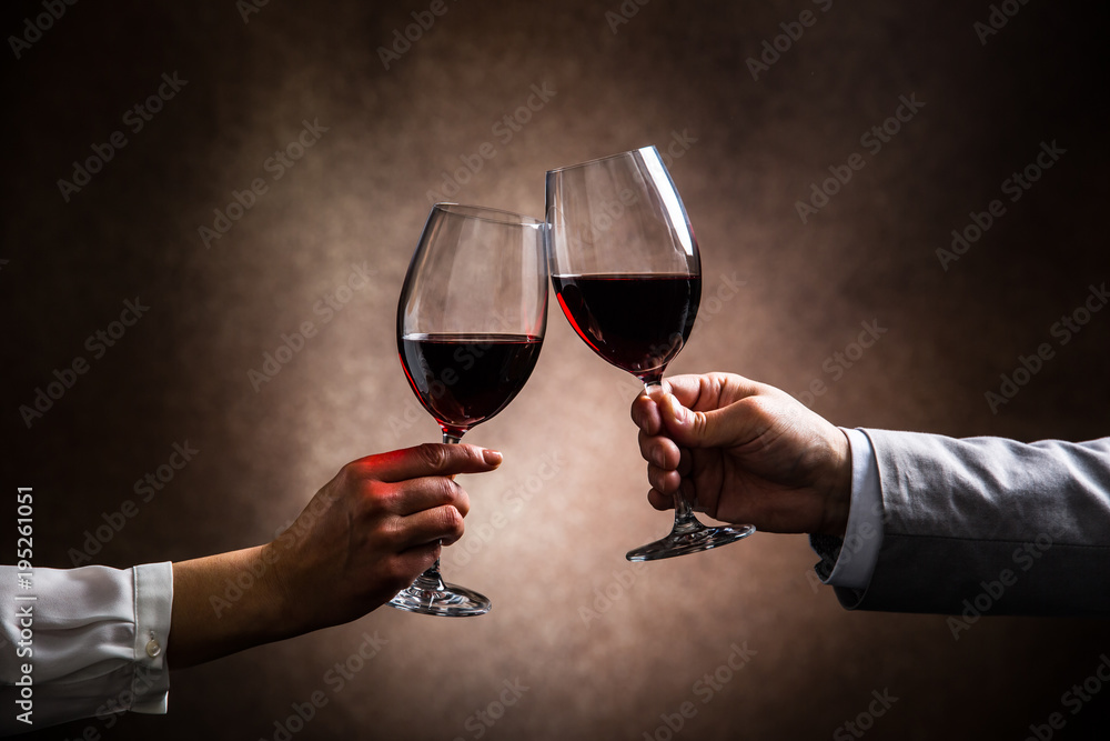 toasting with wine glasses Stock Photo | Adobe Stock