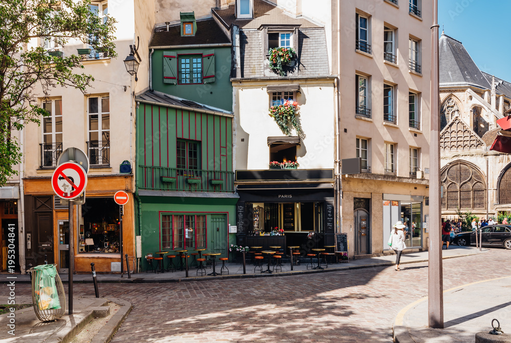 Typical view of the Parisian street with tables of cafe in Paris ...