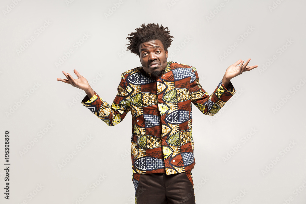 Confused afro man puzzled and say don't know, maybe Stock Photo | Adobe ...