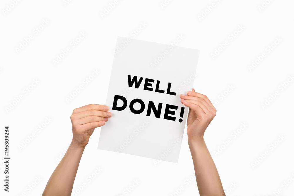 Cropped view of woman hands holding paper with lettering well done ...
